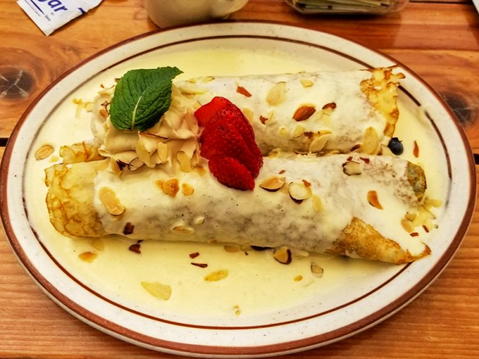 Crepes that make you wonder if you've accidentally teleported to a French caf&eacute;, complete with almond slivers and berry crowns.