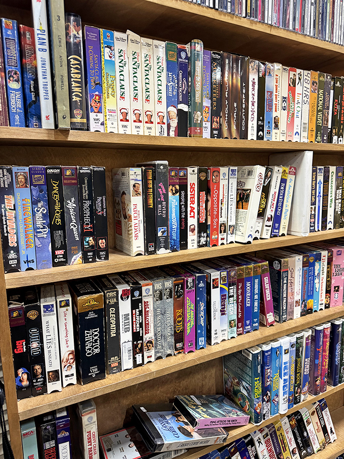 VHS and DVD collections remind us when movie night required actual planning and trip preparation.
