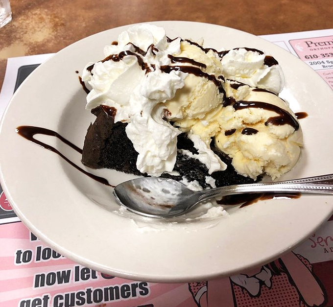 Dessert that doesn't know the meaning of restraint &ndash; ice cream, whipped cream, and chocolate creating a sweet symphony of indulgence.