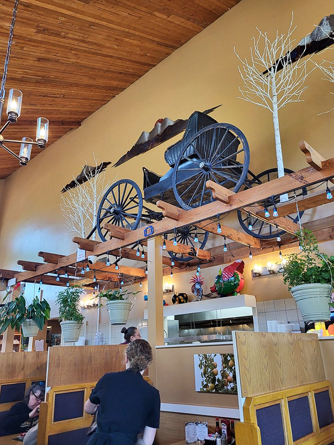 Look up to spot the antique wagon wheel suspended from wooden beams&mdash;rustic charm that pairs perfectly with homestyle cooking.