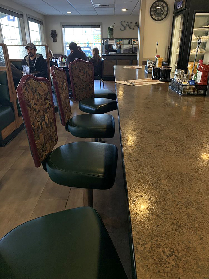 Where strangers become temporary family, united by the universal language of "pass the ketchup, please."