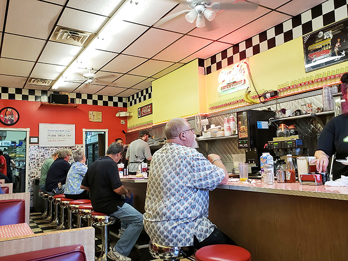 Morning regulars perched at the counter like birds on a wire, participating in the daily ritual of coffee, conversation, and comfort food. 