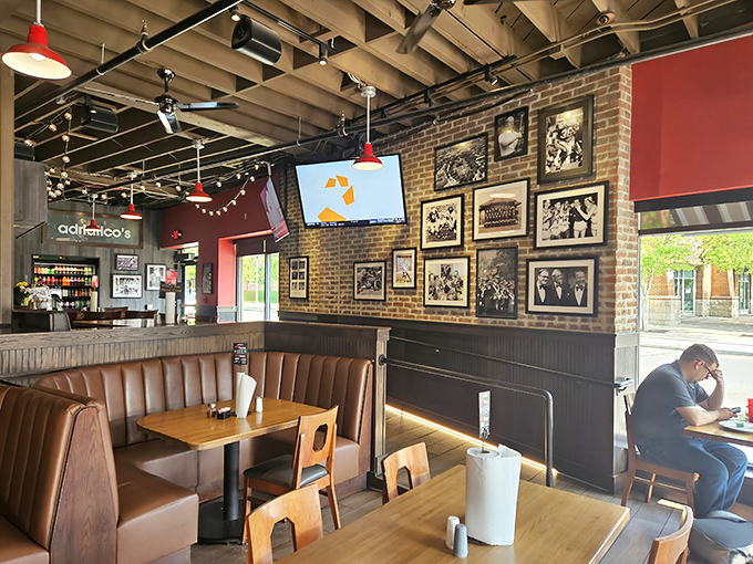The dining area wall gallery &ndash; a visual history lesson of Columbus sports moments that pairs perfectly with every slice.
