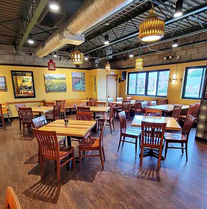 The dining room balances intimate conversations with communal energy, making solo diners and groups equally welcome here.