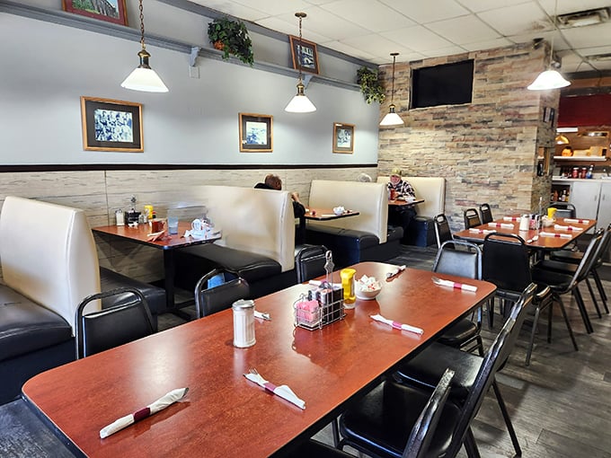 Cream-colored booths and pendant lighting create the perfect backdrop for conversations that flow as freely as the coffee refills.