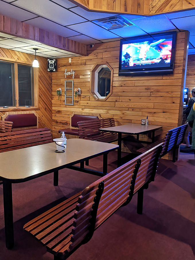 Wood-paneled walls and bench seating create that classic "northwoods cabin meets dining room" vibe that Wisconsin supper clubs have perfected.