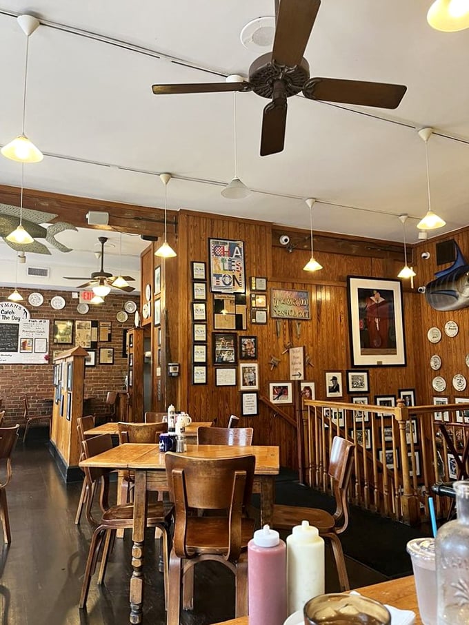 Wooden chairs, ceiling fans, and walls adorned with memories create the perfect backdrop for seafood feasts and conversations that linger.