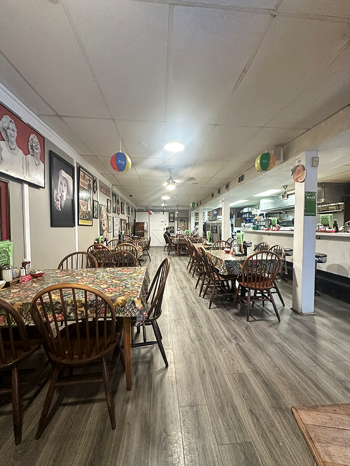 Windsor chairs and floral tablecloths create the perfect backdrop for comfort food conversations. Nostalgia served family-style.