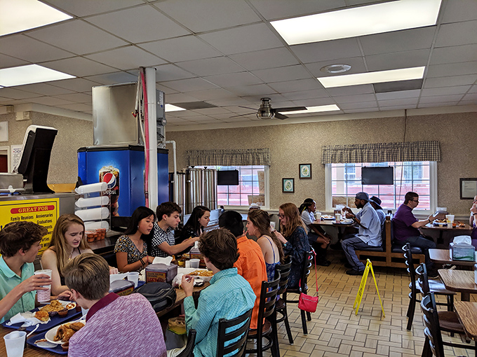 Where strangers become friends united by the universal language of "mmm" and "pass the napkins, please."
