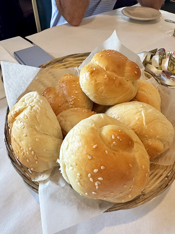 These sesame-topped dinner rolls aren't just bread &ndash; they're edible sponges designed specifically for soaking up every last drop of that magnificent sauce.