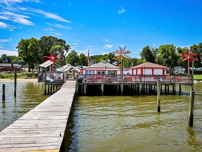 A wooden pier leading to seafood nirvana. Tim's II sits above the water like a red-trimmed mirage for hungry travelers.