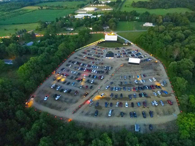 From above, the drive-in transforms into a constellation of cars, each positioned perfectly for an evening of entertainment under open skies.