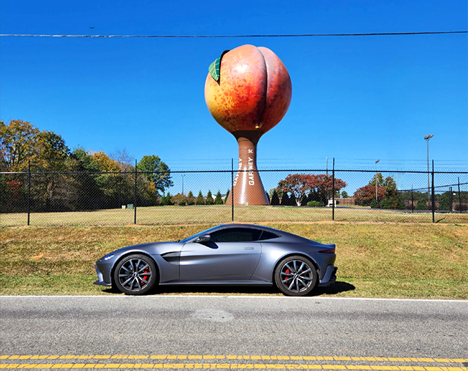 A sleek sports car provides scale &ndash; and perhaps a bit of competition &ndash; for Gaffney's curvy roadside celebrity.