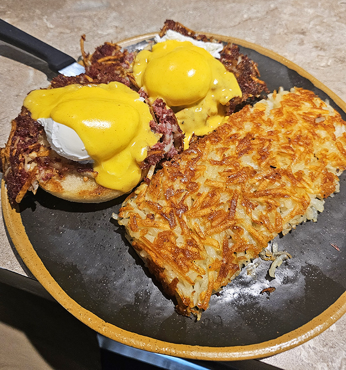 Eggs Benedict reimagined: poached eggs perched atop corned beef hash instead of English muffins&mdash;a breakfast rebellion worth joining.