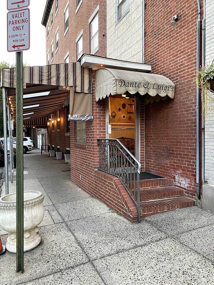 The brick entrance with its classic awning doesn't just mark a doorway&mdash;it's a portal to one of Philadelphia's most beloved Italian dining experiences.