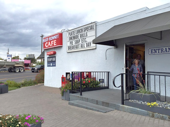 The welcoming entrance with its cheerful flowers says "come on in" even before the aroma of home cooking does.