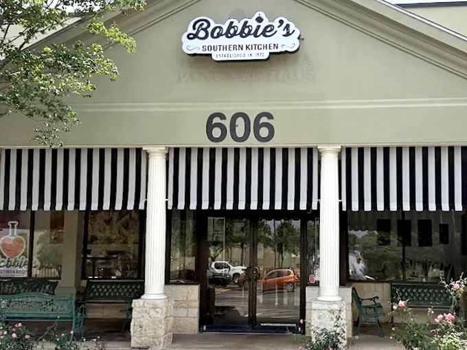 The entrance to Bobbie's promises no gimmicks, just columns, striped awnings, and the understanding that good food awaits inside.