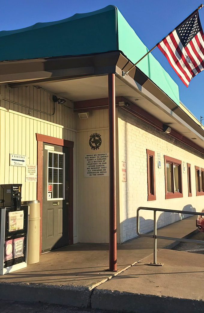 An American flag waves welcome at the entrance, where a Texas star reminds you exactly which state takes its comfort food most seriously.