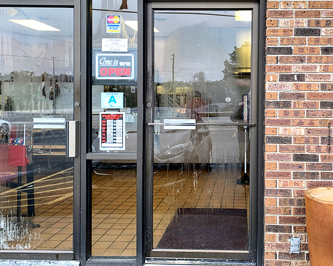 The entrance promises no frills, just honest food&mdash;a glass door that might as well be a portal to a simpler time when meals weren't photographed, just thoroughly enjoyed.