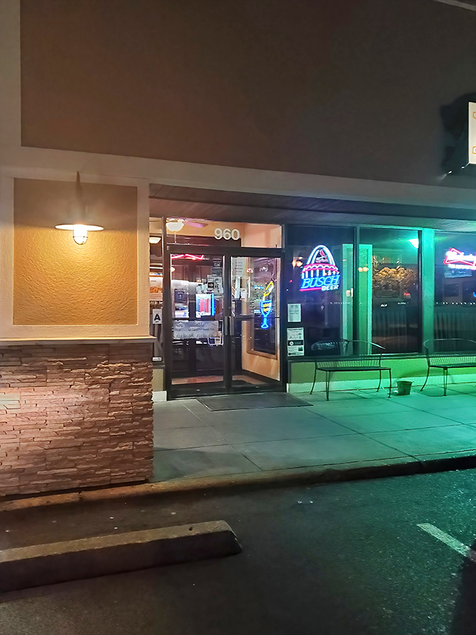 As evening falls, the neon glow beckons hungry travelers like a lighthouse guiding ships to safe harbor&mdash;except this harbor serves pork tenderloin.