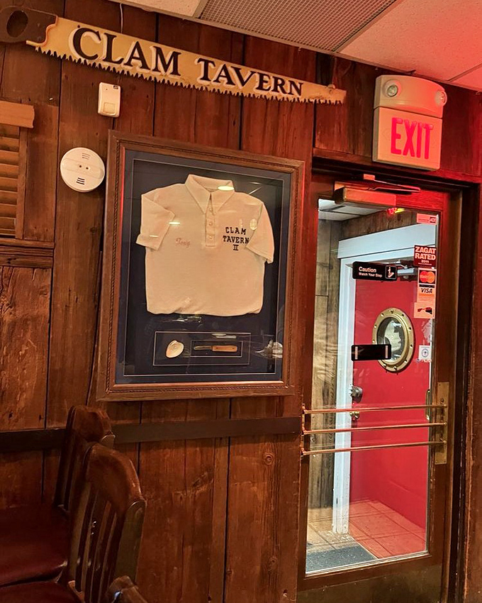 A framed Clam Tavern shirt and that signature red door&mdash;small touches that speak to decades of seafood tradition and local pride.