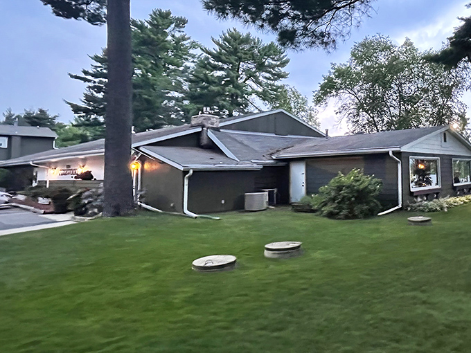 As dusk settles over the property, the Pinewood transforms from daytime retreat to evening haven, promising warmth and satisfaction inside.