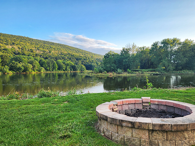 A riverside firepit that practically begs for ghost stories, marshmallows, and conversations that last until the stars take over.