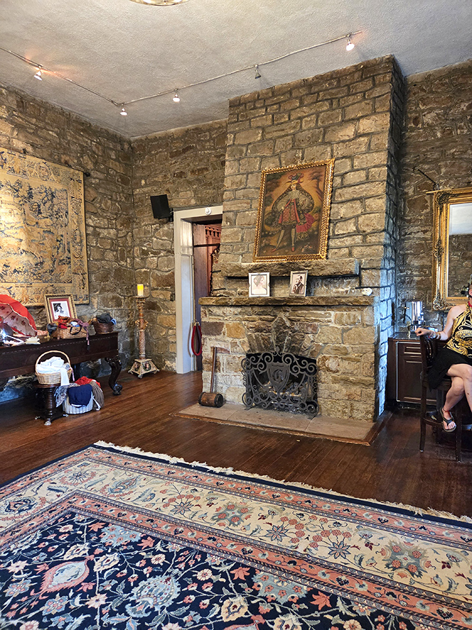 The stone fireplace has witnessed countless conversations, its warm glow illuminating both the room and imaginations of visitors for generation