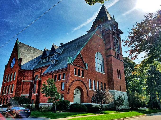 First Congregational Church stands as a red brick masterpiece, its architecture a reminder of when buildings were designed to inspire awe.