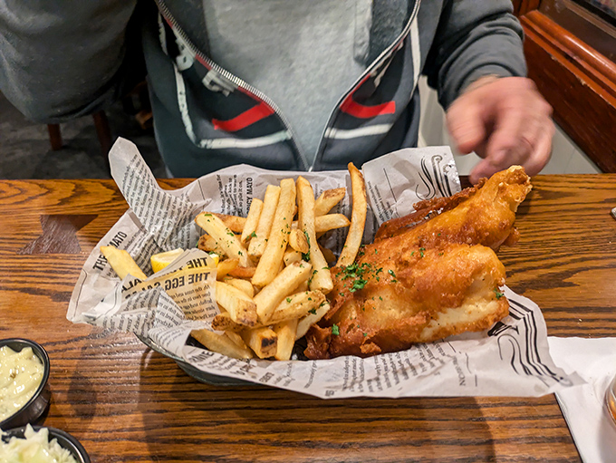 Fish and chips served on newspaper&mdash;old-school done right. That golden batter is the superhero cape this fresh fish deserves. 