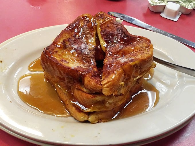 French toast so perfectly golden and syrup-soaked it makes you wonder if breakfast might actually be the most important relationship of the day.
