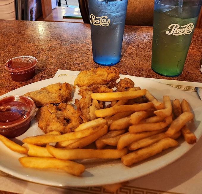 Golden-fried perfection meets crispy french fries&mdash;a plate that doesn't need fancy garnishes to announce its deliciousness to the world.
