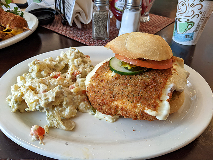 A fried cheese sandwich that makes grilled cheese hang its head in shame&mdash;crispy, gooey, and served with a side of potato salad perfection.