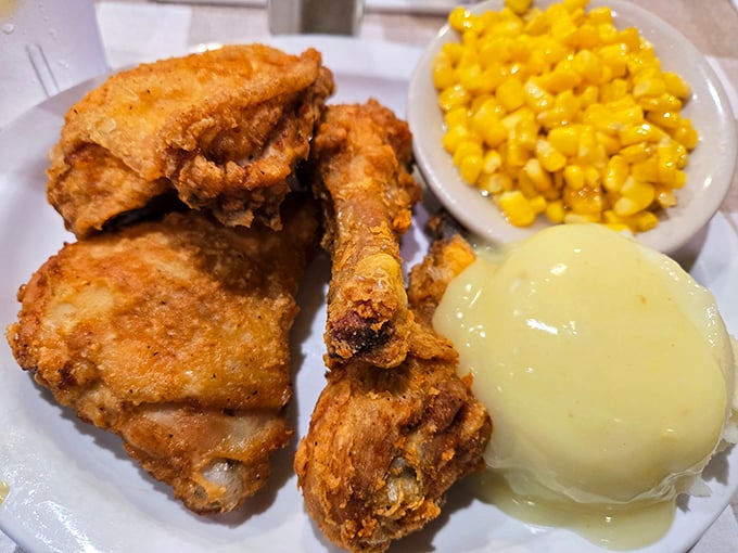 Fried chicken that achieves the impossible trifecta: shatteringly crisp exterior, juicy interior, and seasoning that makes you wonder why you ever eat anything else.