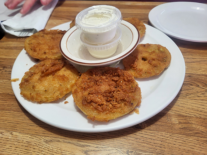 Fried green tomatoes &ndash; tangy slices in a cornmeal jacket, served with a dipping sauce that makes you want to high-five the chef.