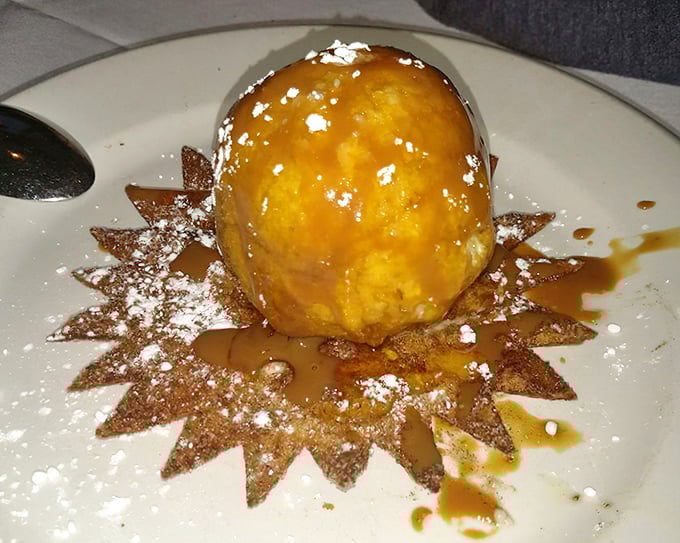Fried ice cream – where hot meets cold in a dessert that defies physics and delights taste buds, presented like a sweet little sun.