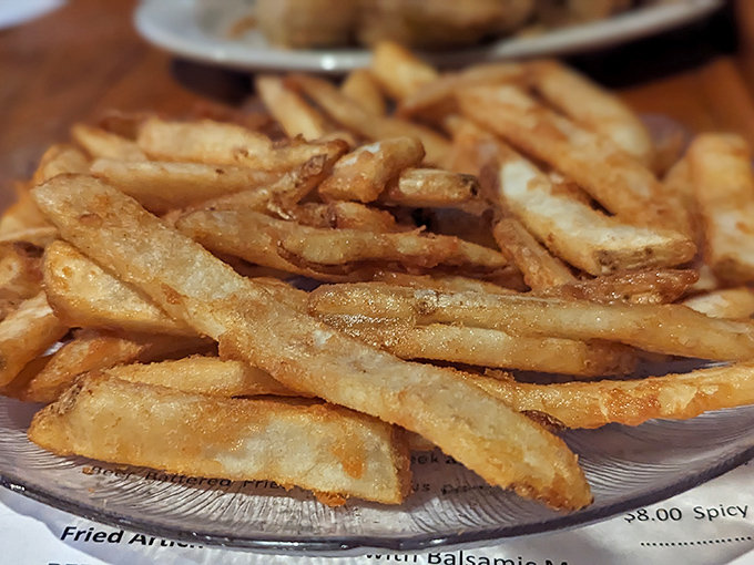 These aren't just fries &ndash; they're golden wands of potato perfection that somehow maintain their crispness from first bite to last.