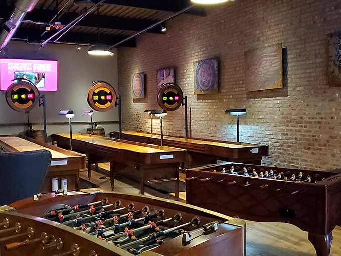 When the food coma hits, the game room awaits with shuffleboard tables that have settled more friendly disputes than a small claims court.