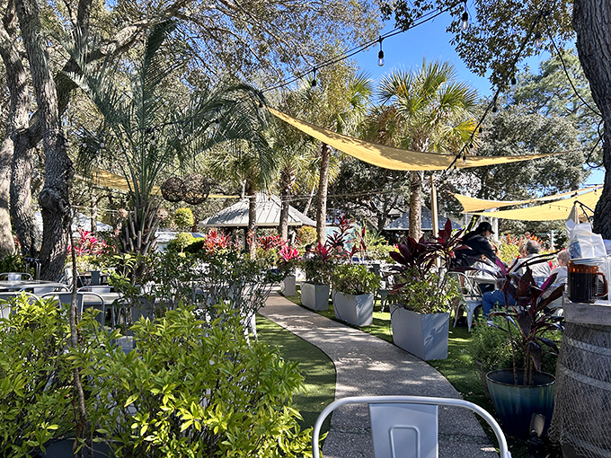 Garden pathways lined with tropical plants create a lush paradise that makes every visit feel like a vacation.