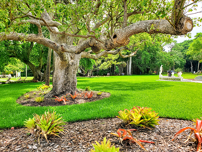 Ancient trees spread their branches across manicured lawns, their twisted trunks telling stories as old as the estate itself.