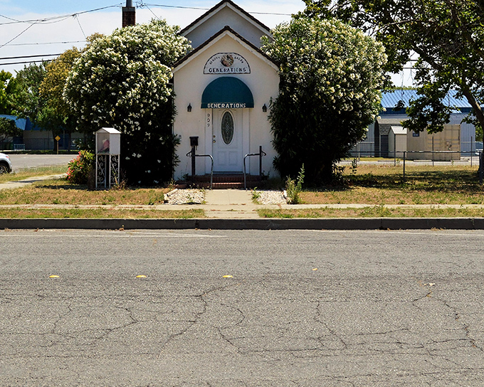 The charming Generations building, framed by flowering shrubs, represents Orland's commitment to community connection &ndash; where small-town values translate to neighborly support.