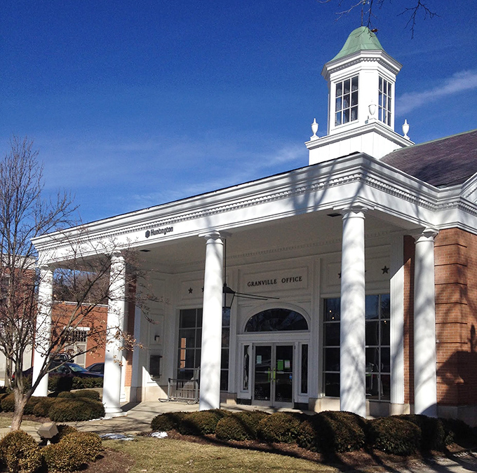 The Granville Office building's stately columns and symmetrical design make even mundane errands feel like civic duties of historical importance.