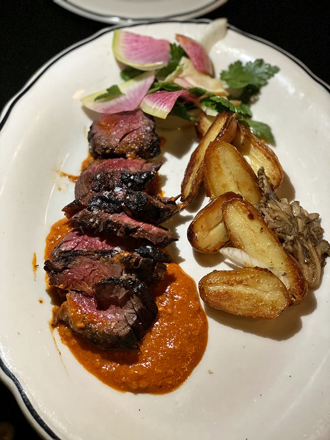 Perfectly seared steak, blushing pink in the center, resting in a sauce so good you'll be plotting ways to lick the plate discreetly.