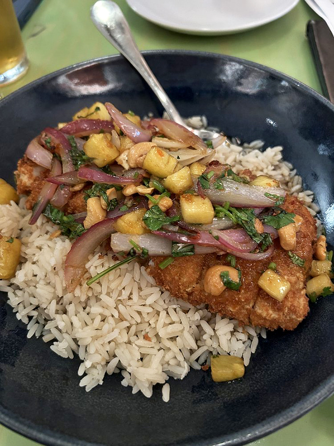 Sweet potato crusted fish over coconut rice&mdash;a dish so perfectly executed it deserves its own fan club.