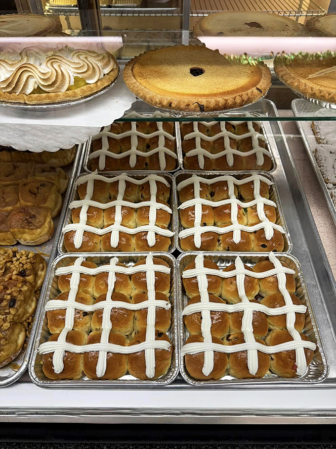 Hot cross buns lined up like they're auditioning for Easter's greatest hits album.