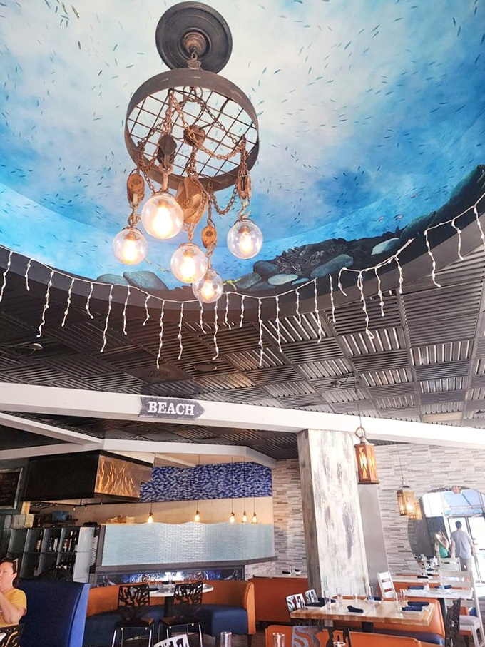 Look up and you're underwater &ndash; that ceiling with its ocean-blue paint and fishing net chandelier is nautical whimsy at its finest.