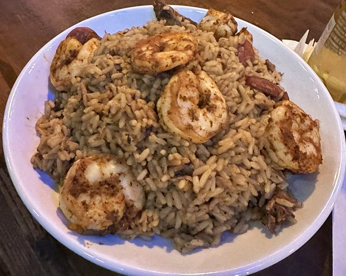Jambalaya with plump shrimp scattered like buried treasure throughout seasoned rice. A dish that tells stories with every bite.