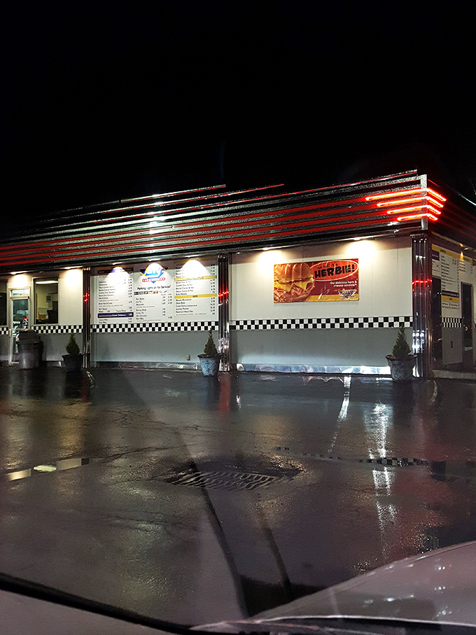 At night, Jerry's glows like a neon promise of satisfaction. The illuminated stripes call to hungry travelers like a lighthouse guides ships home.