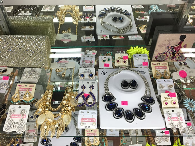 The jewelry counter sparkles with costume treasures and occasional genuine gems. Someone's discarded statement necklace becomes tomorrow's conversation starter.