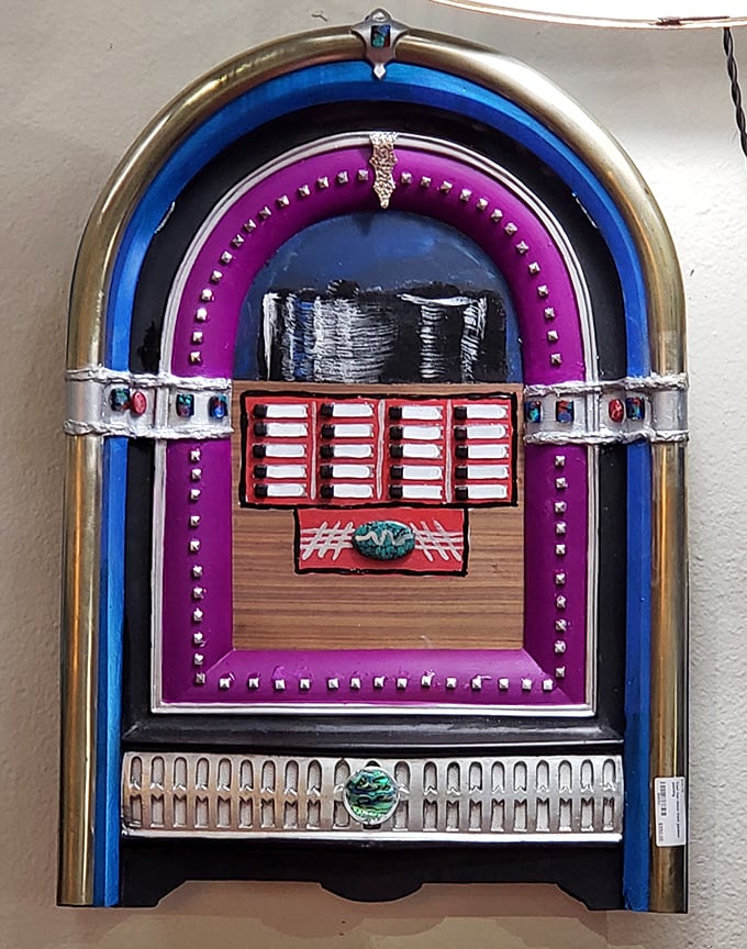 Jukebox art that makes Spotify look boring. This colorful wall-mounted piece celebrates the days when selecting music was a physical, coin-dropping experience. 